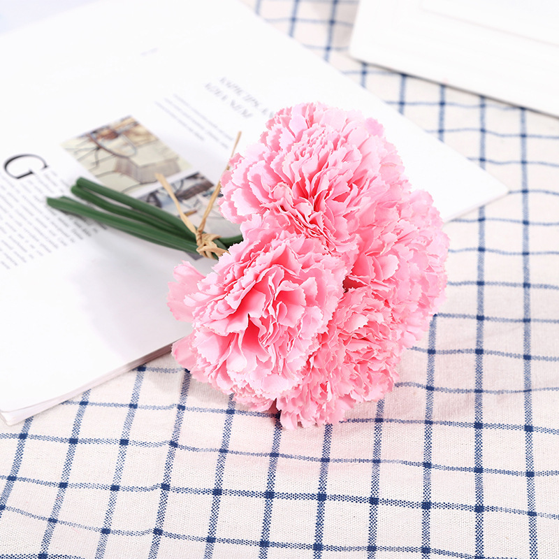 Four hand-carved carnations