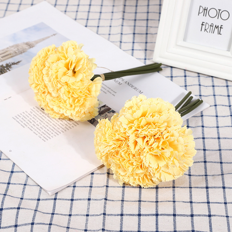 Four hand-carved carnations