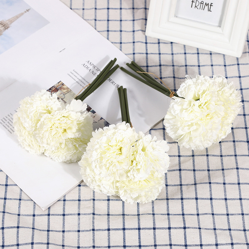 Four hand-carved carnations